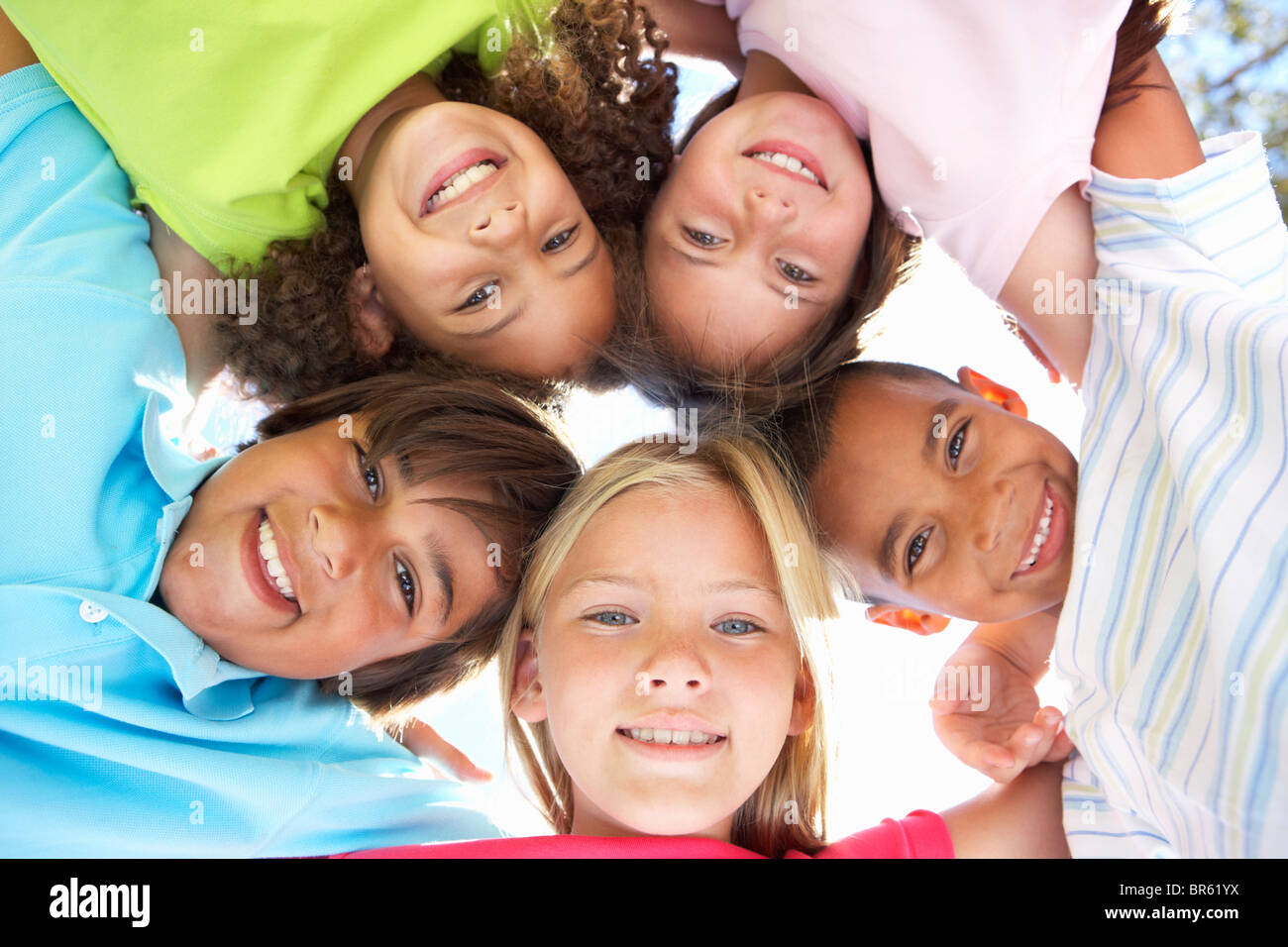 Group Of Children Looking Down Into Camera Stock Photo - Alamy