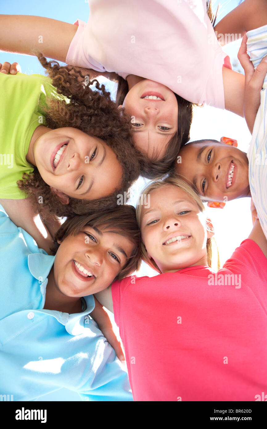 Group Of Children Looking Down Into Camera Stock Photo - Alamy