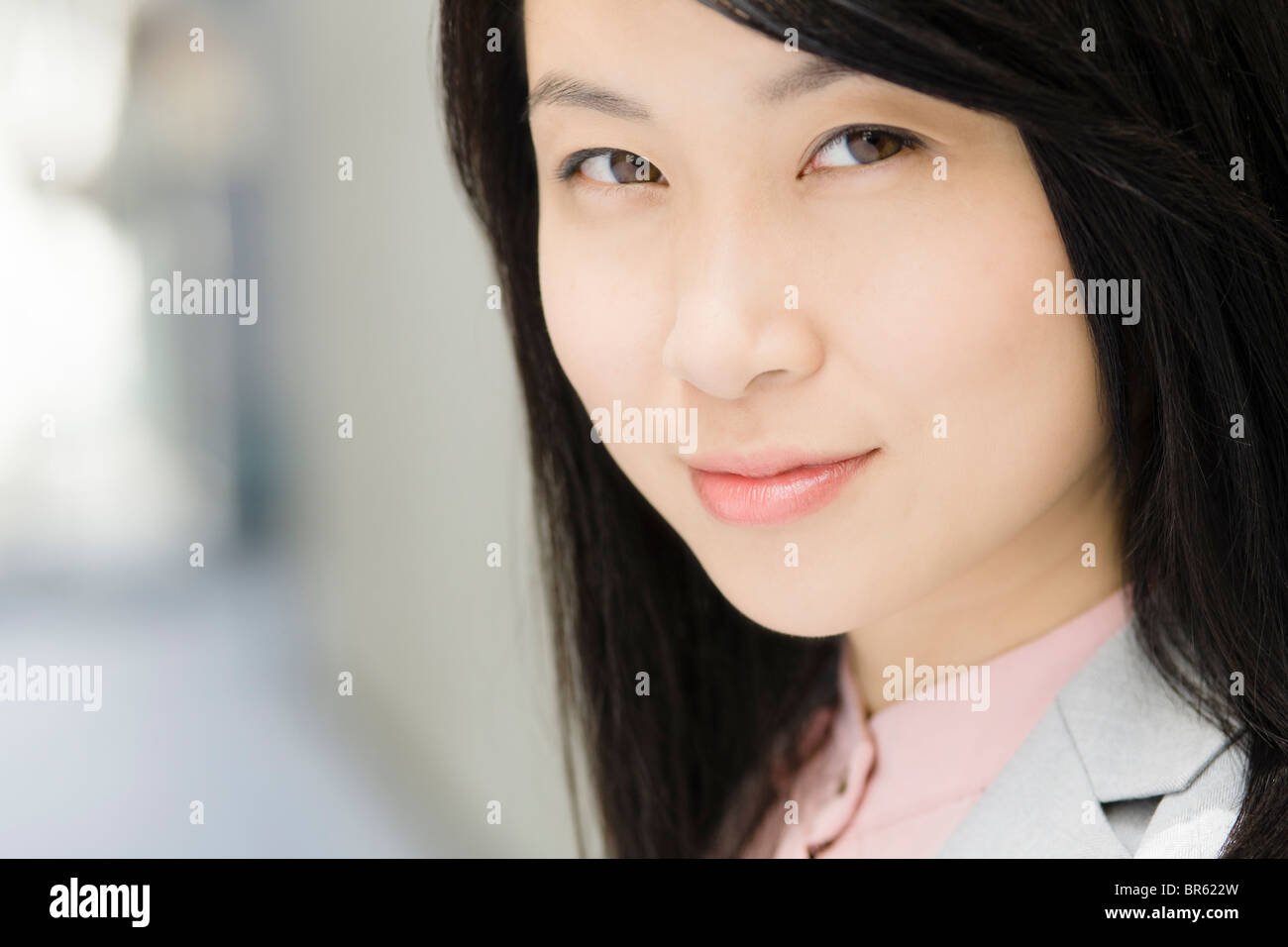Smiling Chinese businesswoman Stock Photo - Alamy