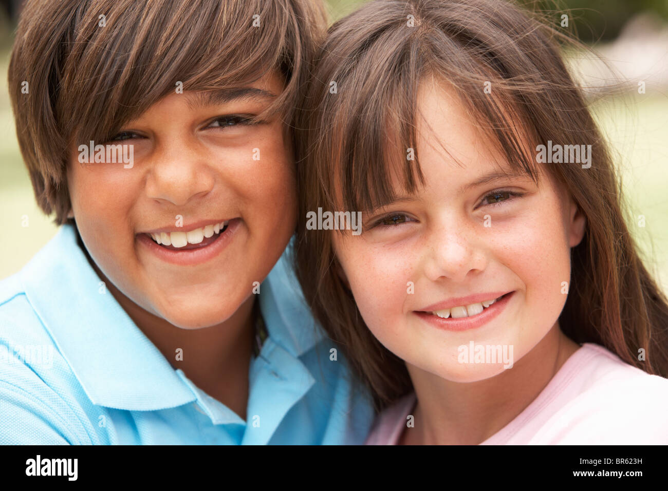 Two Children In Park Giving Each Other Hug Stock Photo - Alamy