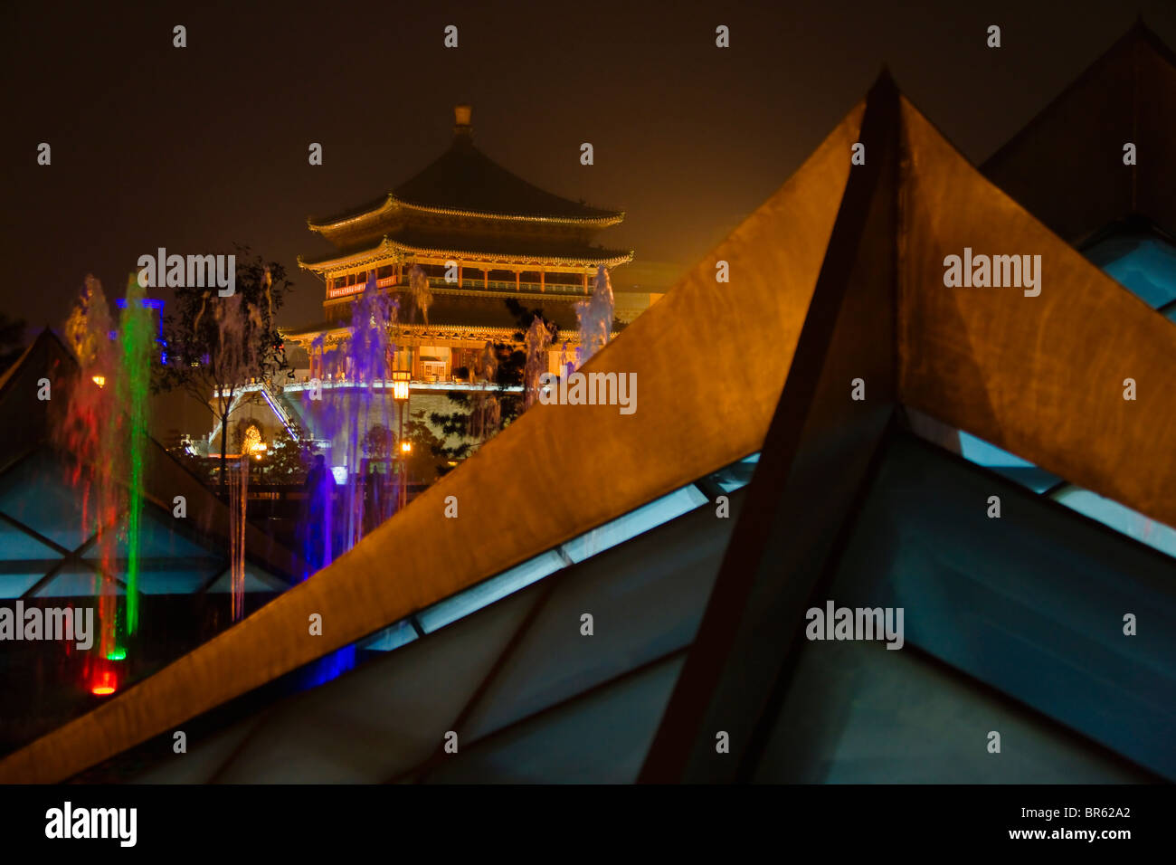 Night view of Bell Tower with pyramid shaped building, Xian, Shaanxi ...