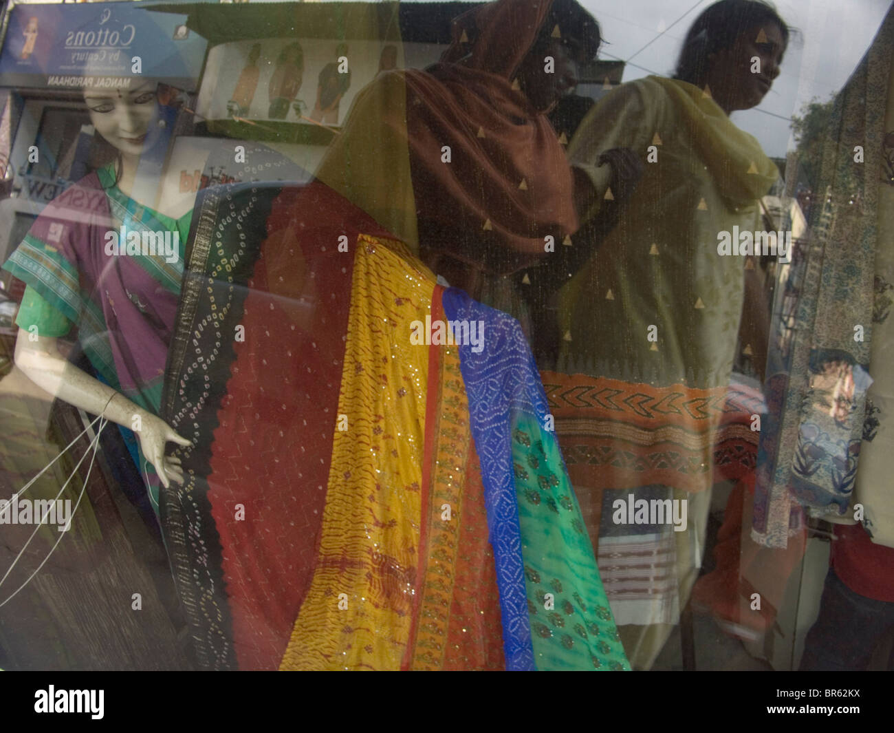 Reflections in an Indian shop window Stock Photo - Alamy