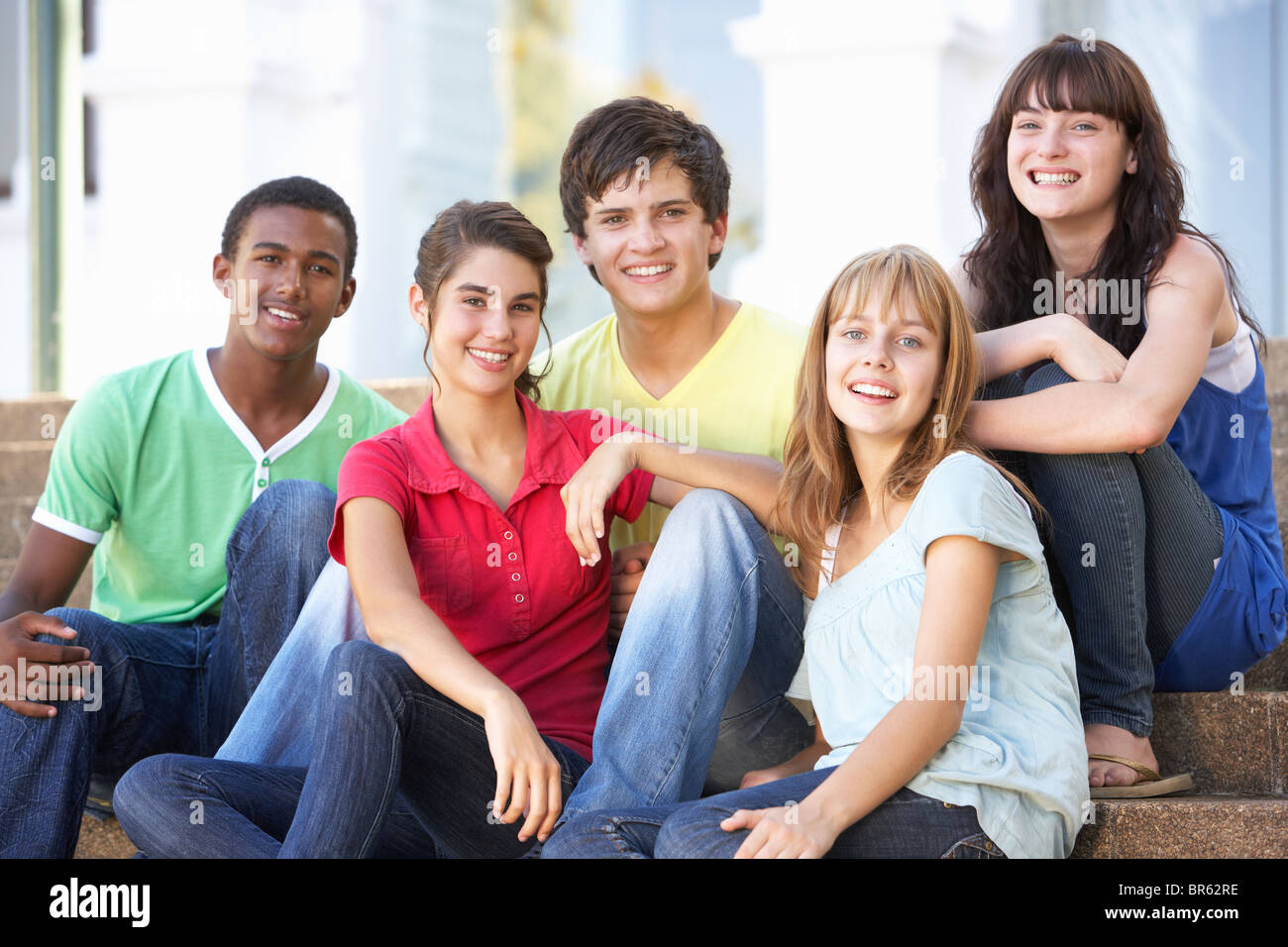 Group Of Teenage Friends Sitting On College Steps Outside Stock Photo ...