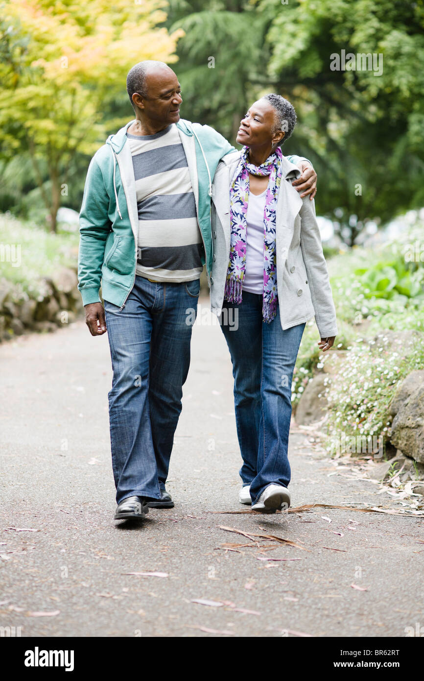 Black Couple Walking In Park