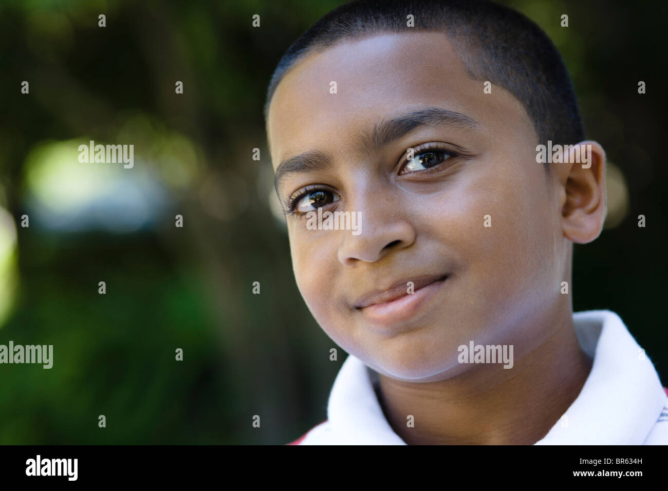 Smiling mixed race boy Stock Photo - Alamy