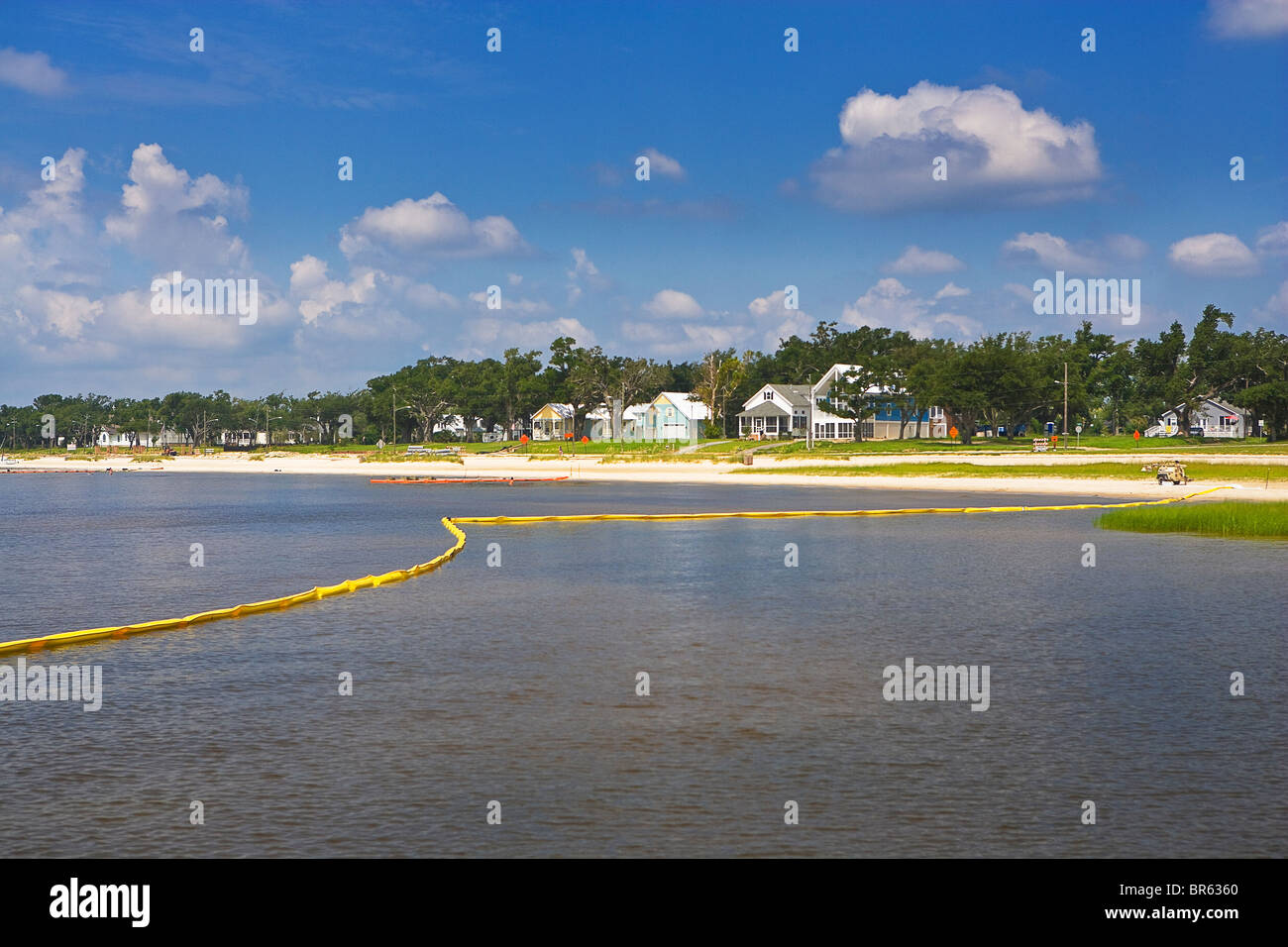 Yellow oil boom protects a small and quiet bay along the Gulf Coast ...