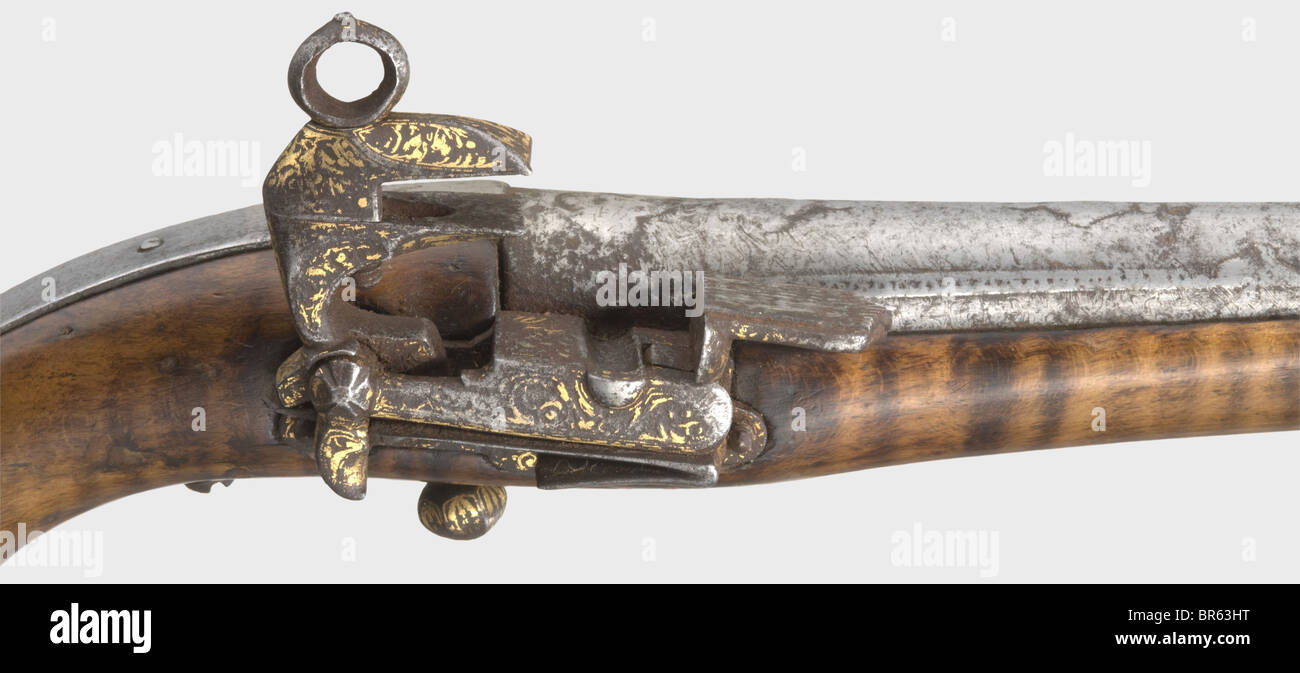 A Caucasian miquelet-lock pistol, 19th century. Round, Damascus barrel ...