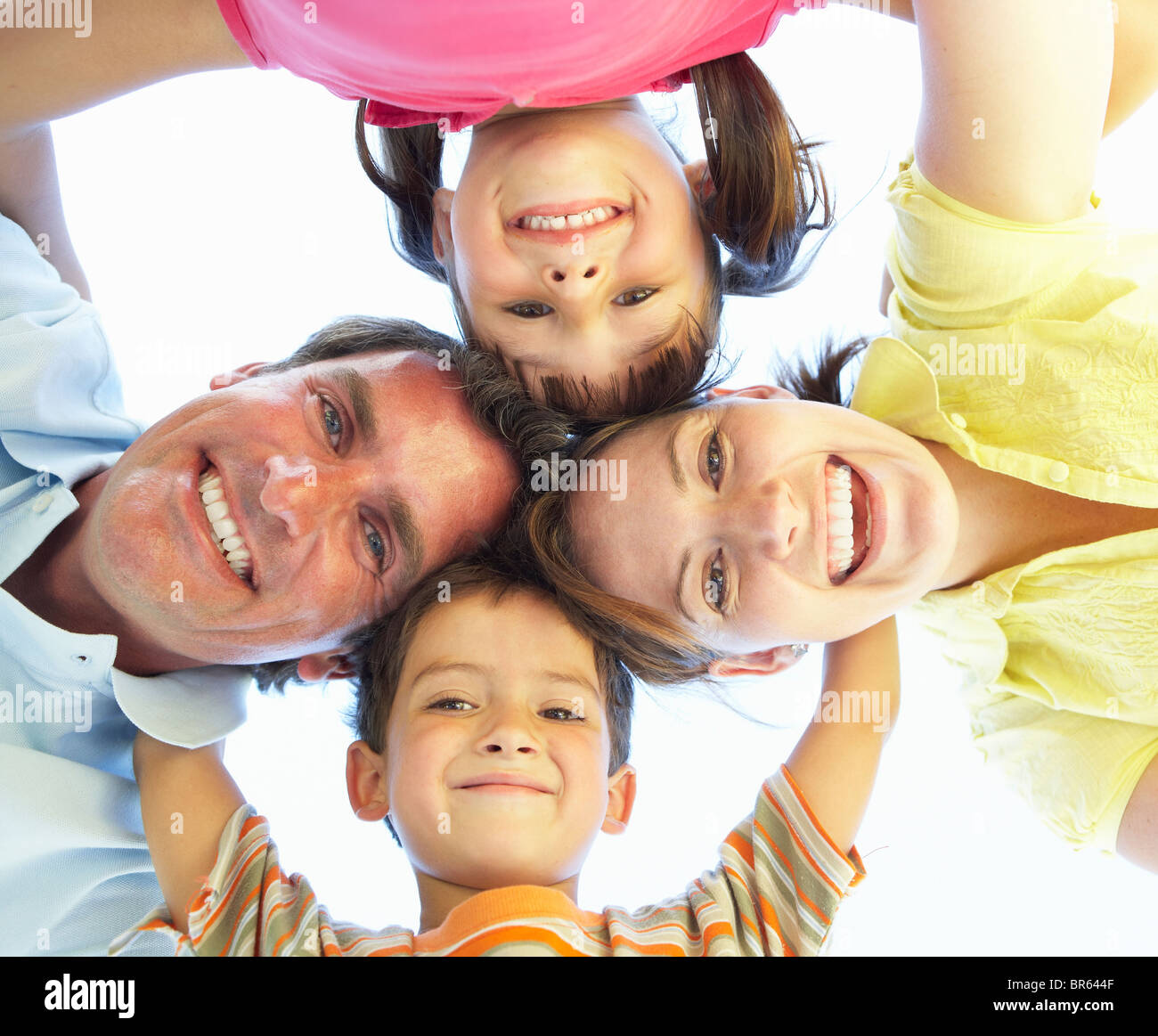 Family Group Looking Down Into Camera Stock Photo - Alamy