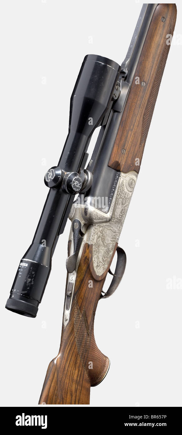 A heavy deluxe over-and-under rifle with two interchangeable barrels ...