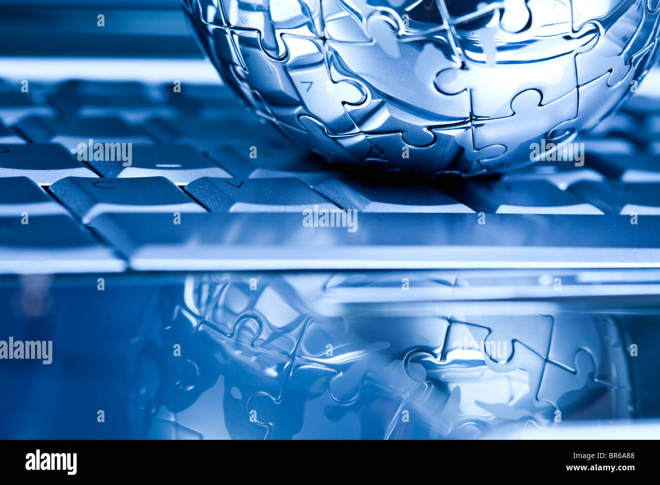 Globe and computer Stock Photo - Alamy