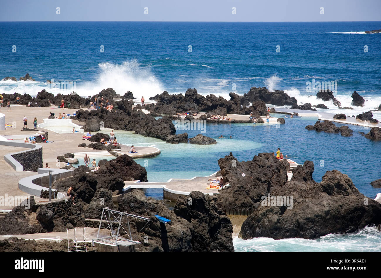 Port Moniz bathers amongst rocks Stock Photo - Alamy