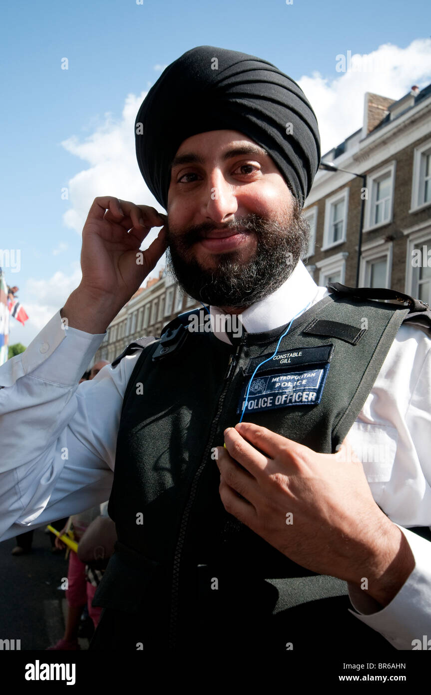 Asian London police officer with turban at Notting Hill Carnival Stock ...