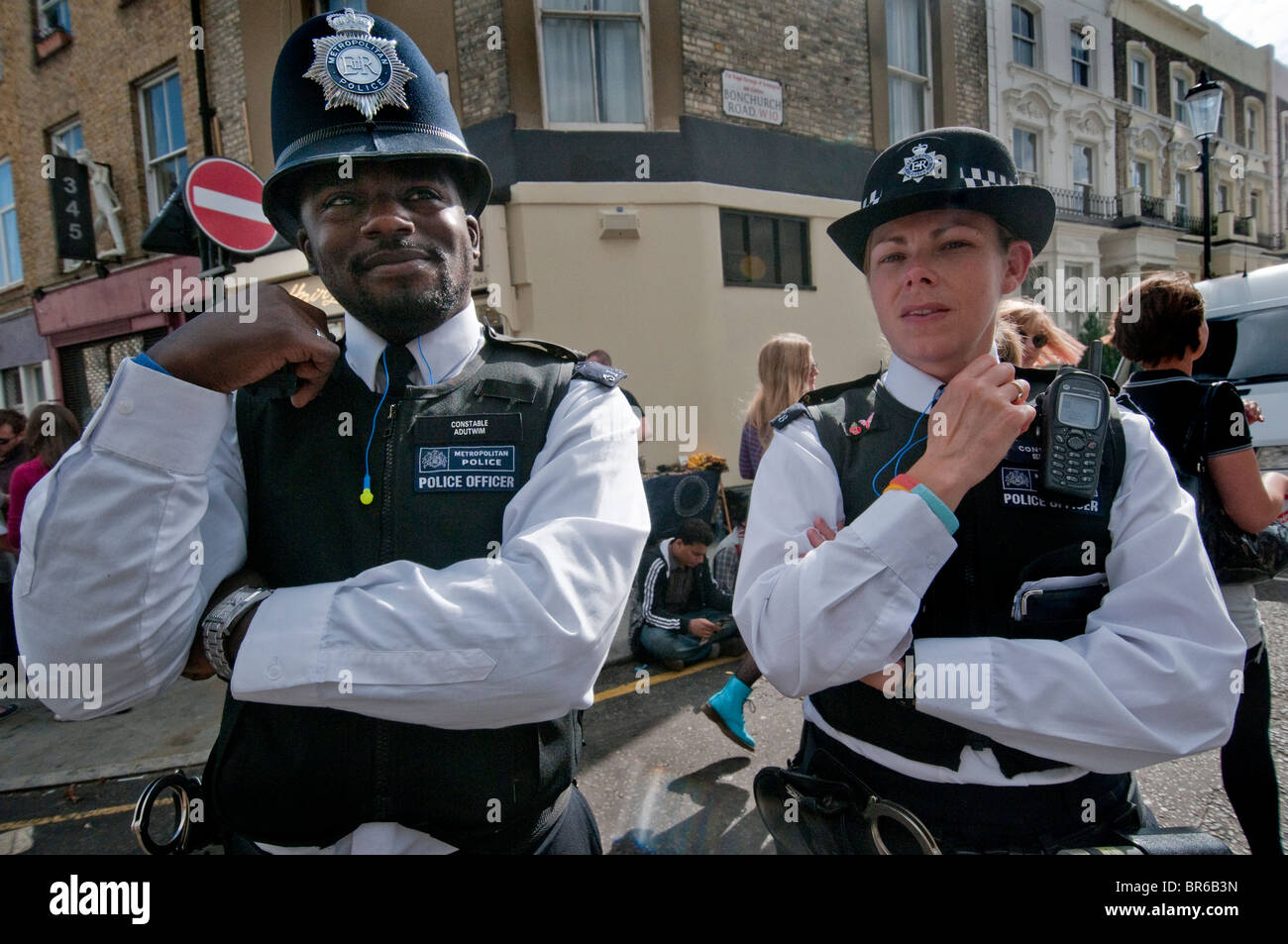 Male and female police officers on the beat in West London Stock Photo ...