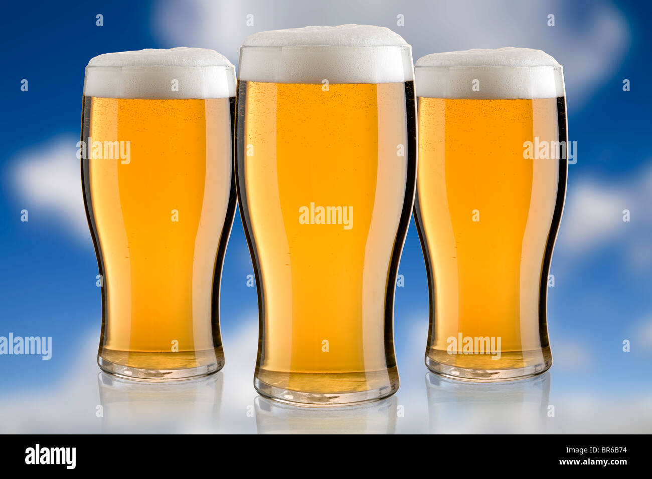 3 beers on a sky background Stock Photo - Alamy