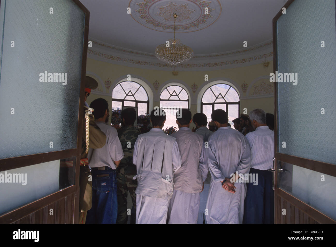 Men crowd in the door to pray at the shrine of Ahmad Shah Masood in the ...
