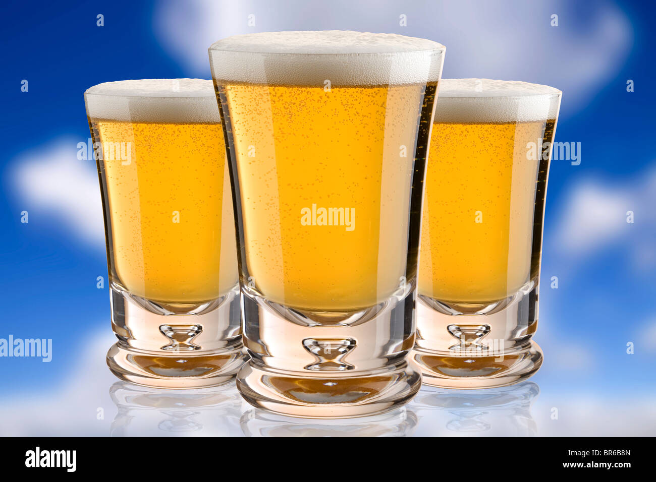 3 beers on a sky background Stock Photo - Alamy