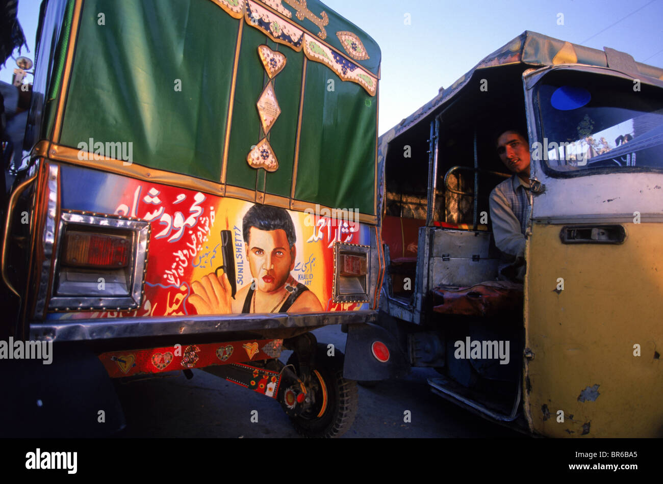 Motorized rickshaws with brightly painted scenes of Indian Stock Photo ...