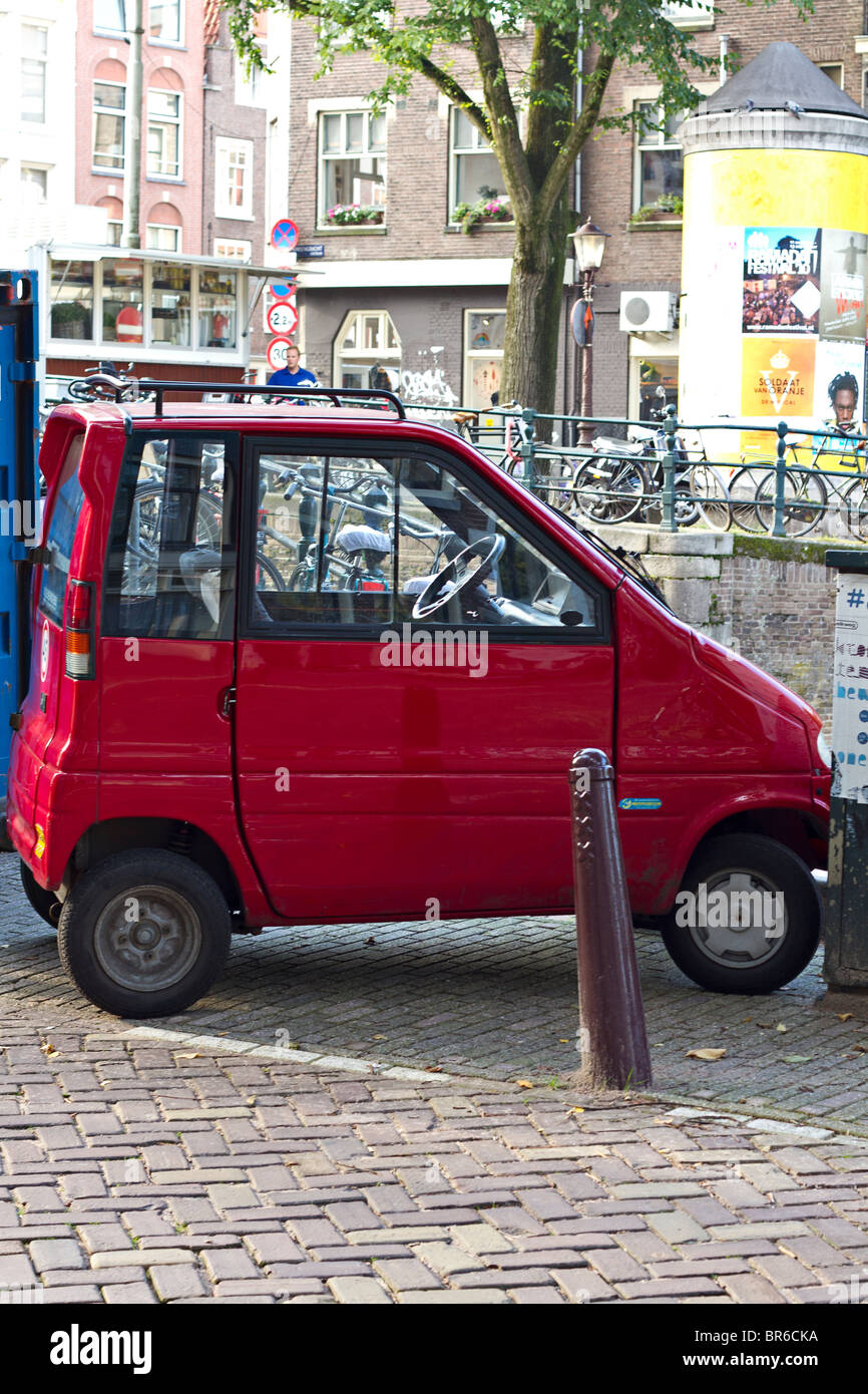 Red Canta LX car parked in small parking space. Amsterdam, Holland ...