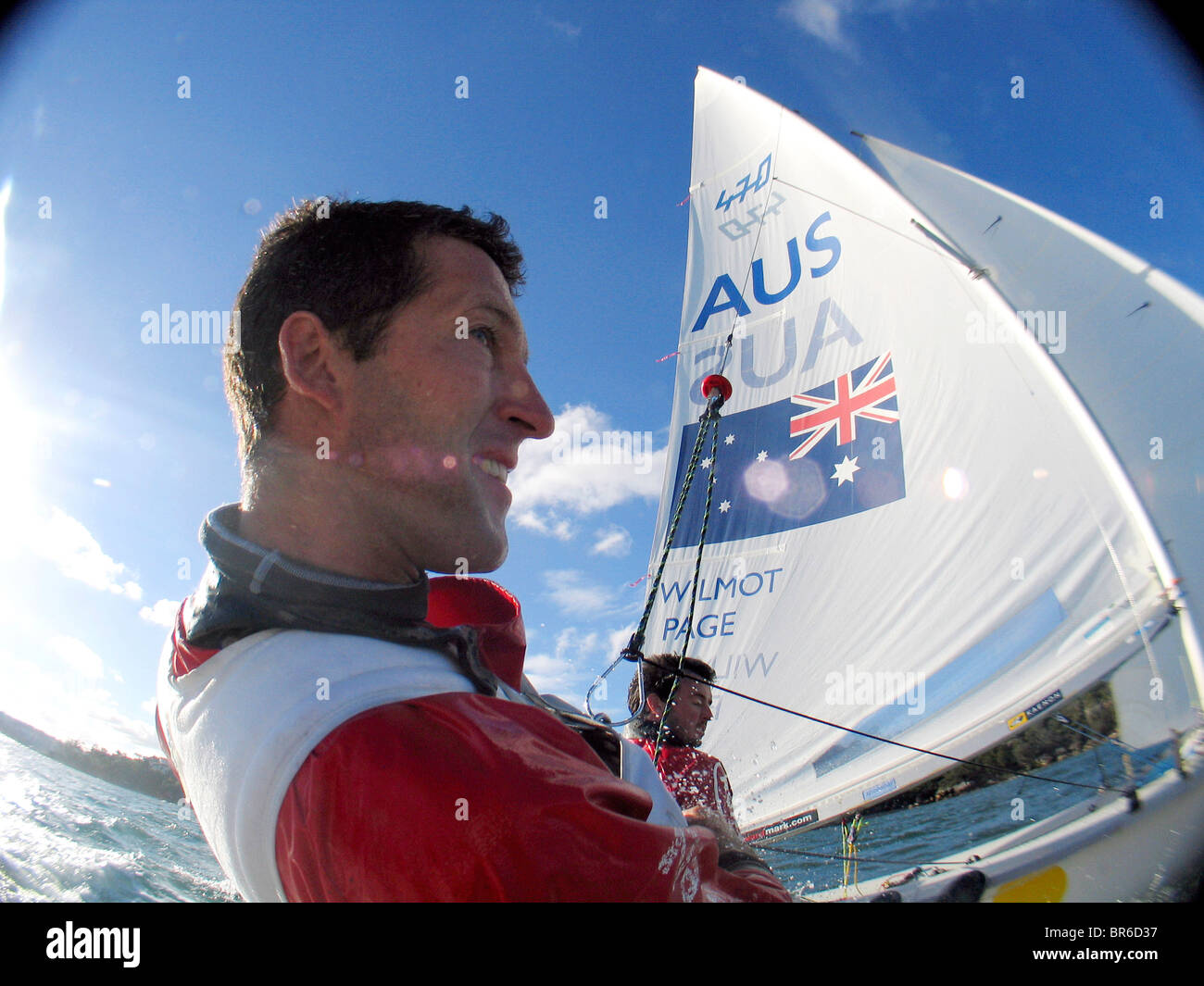 Wide angle perspective of a sailor and his sailboat Stock Photo - Alamy
