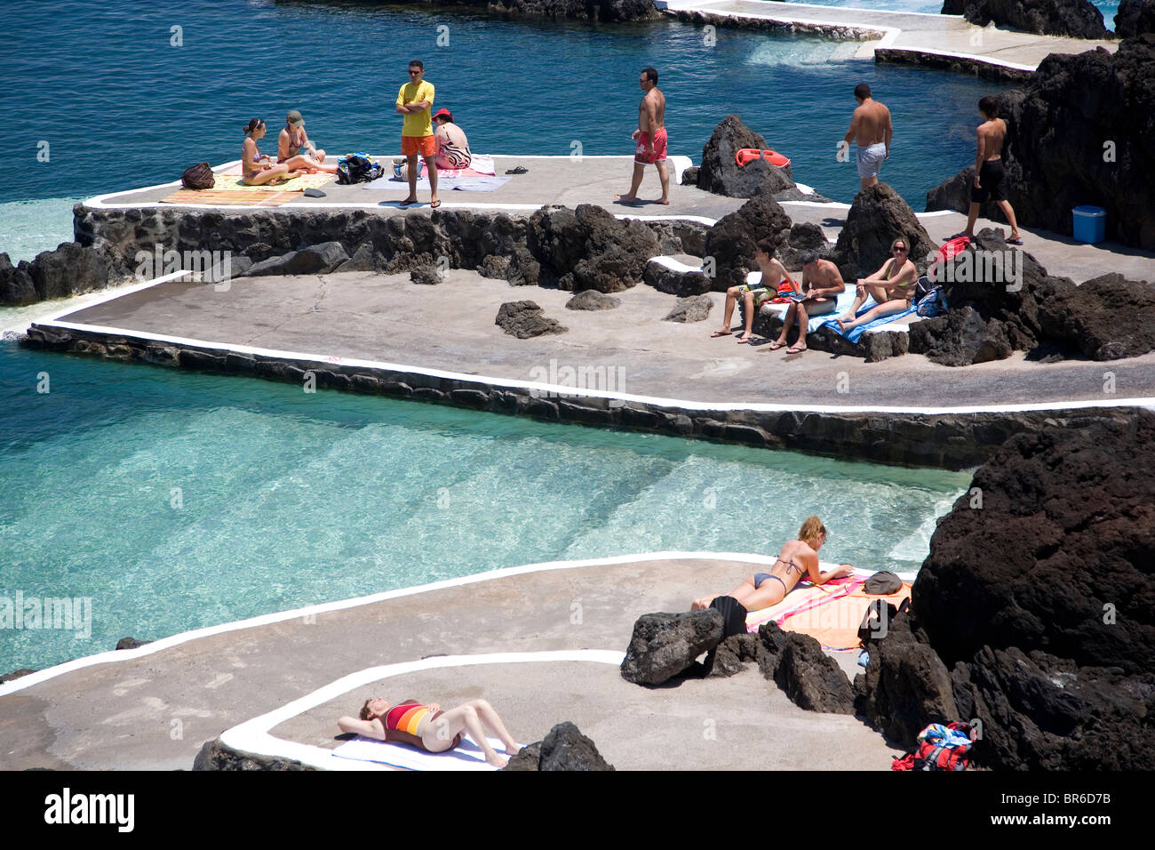 Port Moniz bathers amongst rocks Stock Photo - Alamy