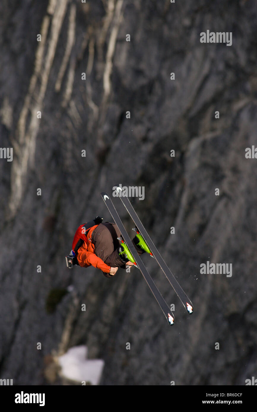 A male Ski BASE jumper jumps off an 800 foot granite cliff Stock Photo ...