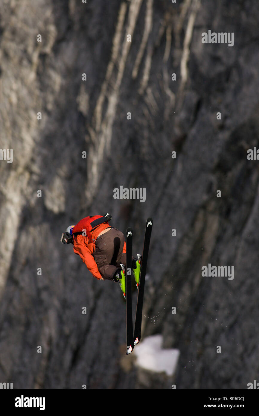 A male Ski BASE jumper jumps off an 800 foot granite cliff in the ...