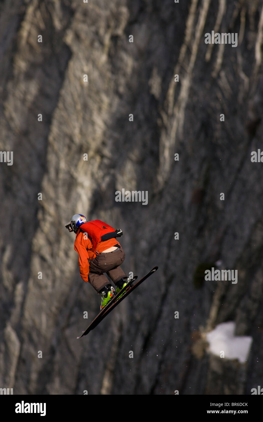 A male Ski BASE jumper jumps off an 800 foot granite cliff in the ...