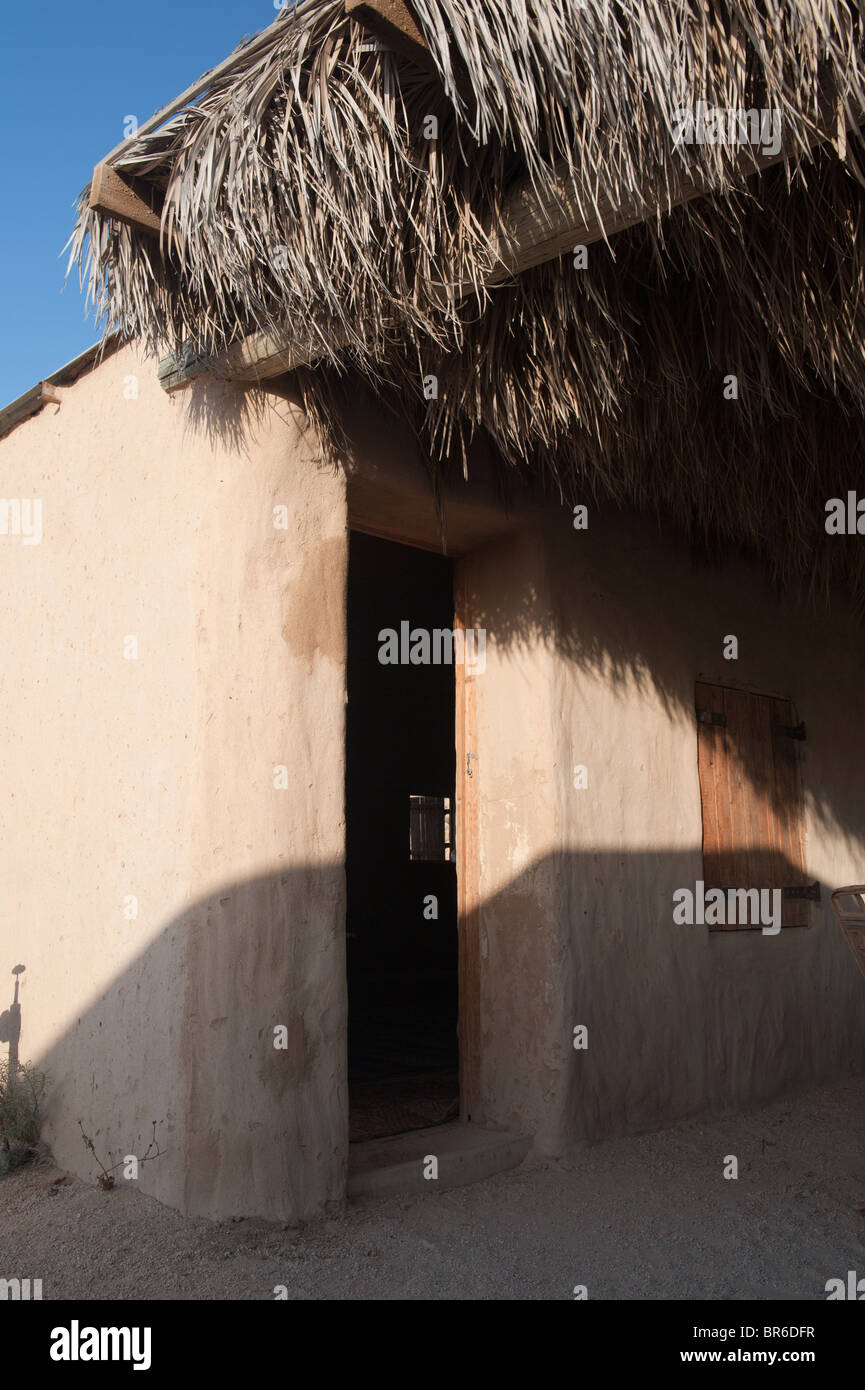 A mud hut in the desert Stock Photo - Alamy