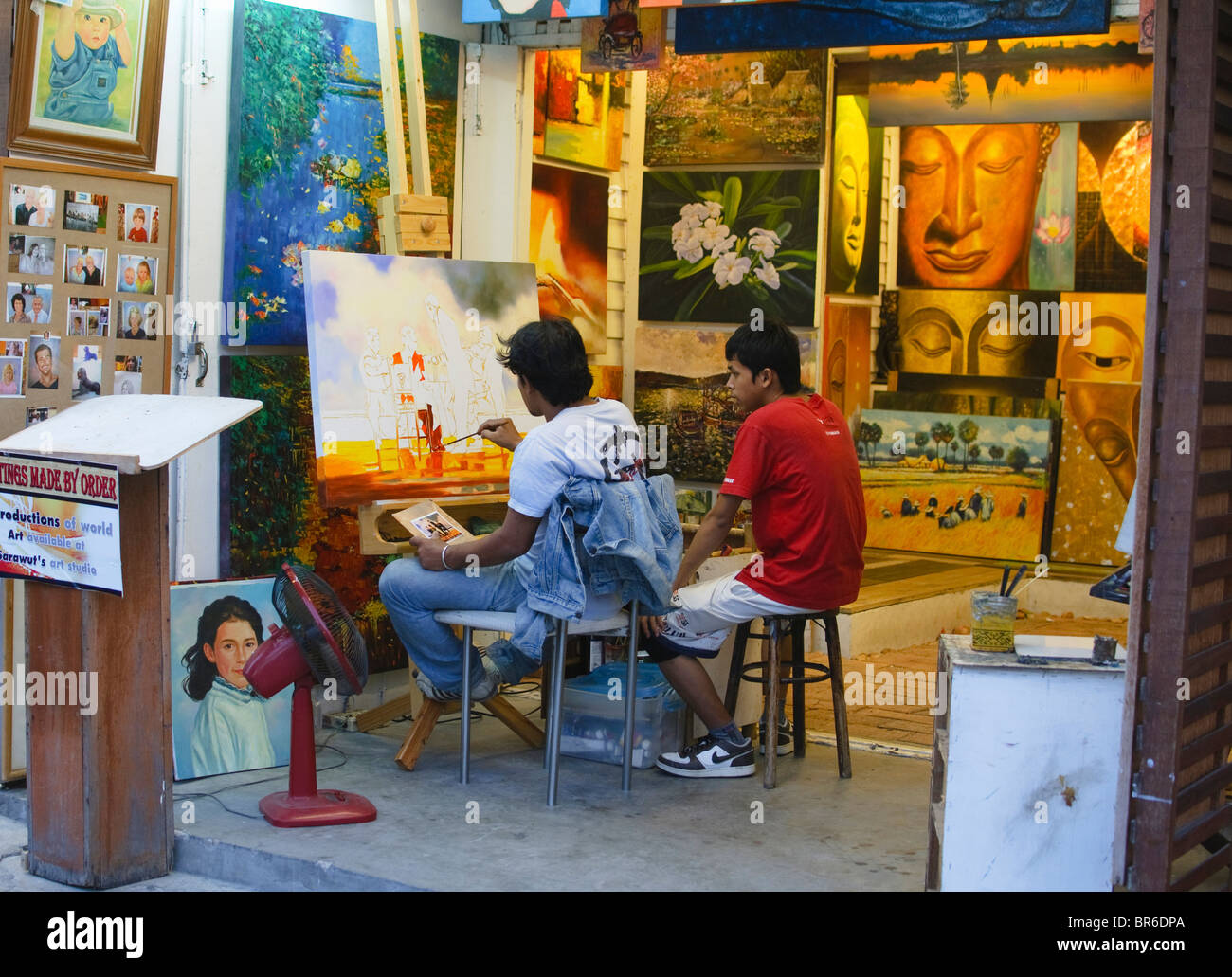 artist painting from a postcard in Hua Hin Thailand Stock Photo - Alamy