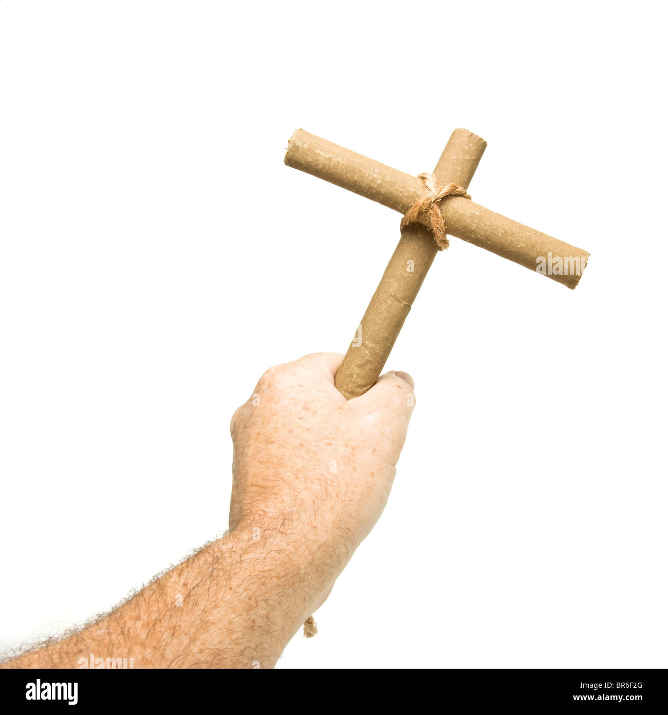 Anti Smoking concept of male hand holding crucifix made from 2 cigars ...