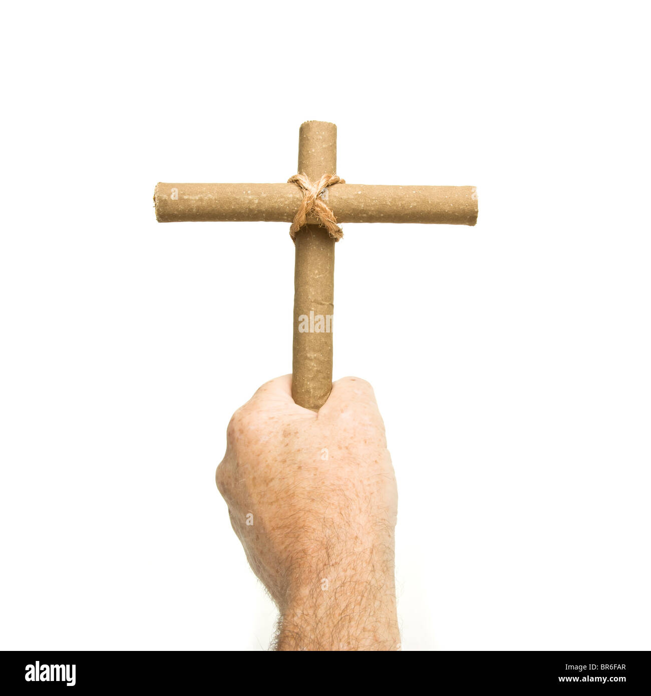 Anti Smoking concept of male hand holding crucifix made from 2 cigars ...