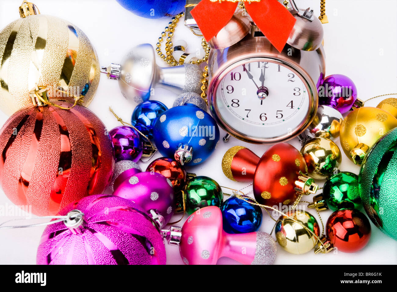 Alarm clock and christmas decorations on a white background-Christmas ...