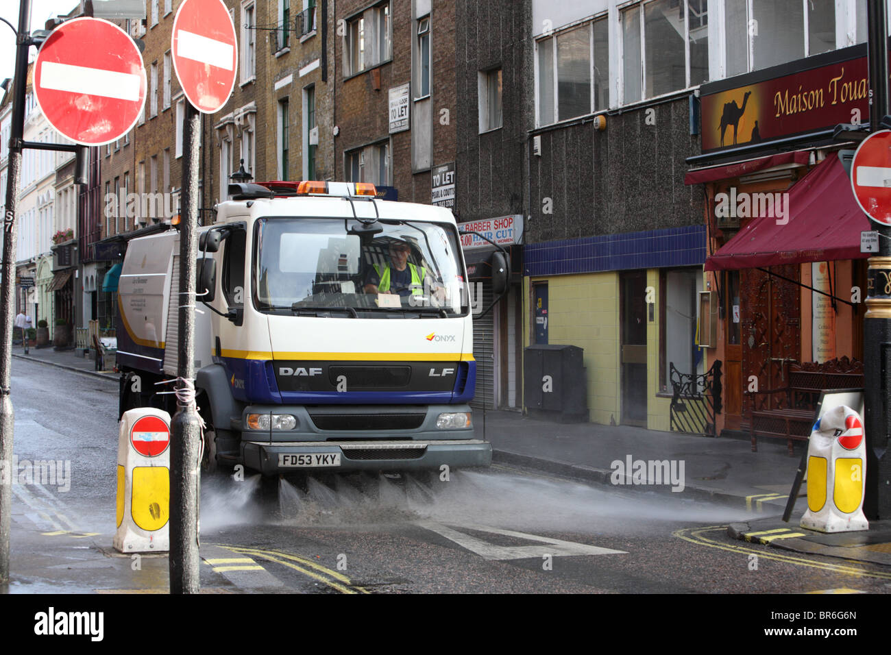 A Road Cleaning vehicle at work early on a Sunday morning entering Old ...