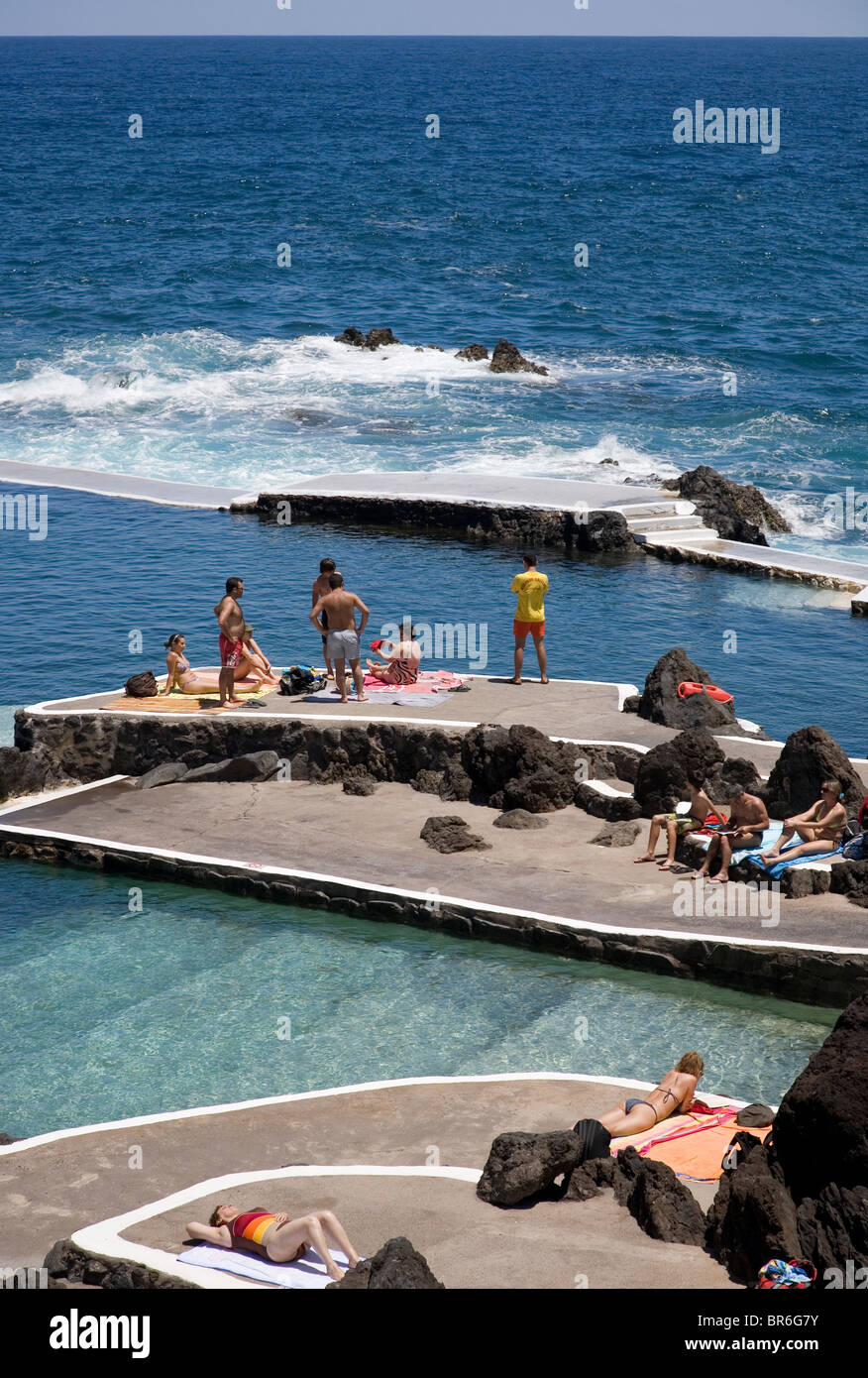 Port Moniz bathers amongst rocks Stock Photo - Alamy