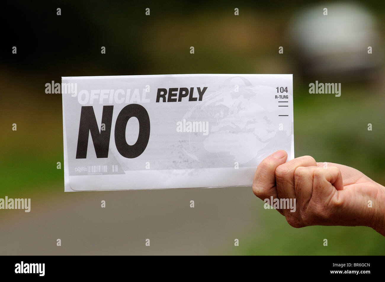 Woman's hand holding an official NO reply envelope Stock Photo - Alamy