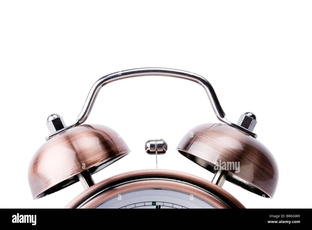 Copper alarm clock with bells on white background Stock Photo - Alamy