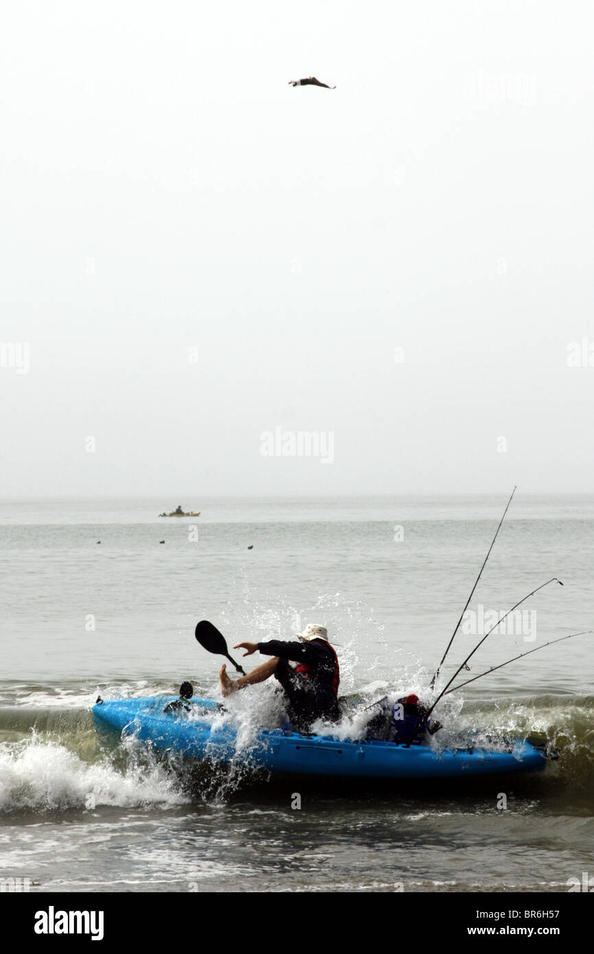 Kayaker being thrown out of his boat Stock Photo - Alamy