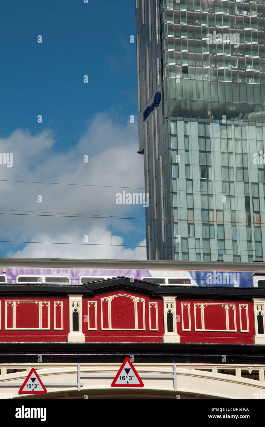 Train traveling over bridge.Deansgate central Manchester.Beetham Tower ...