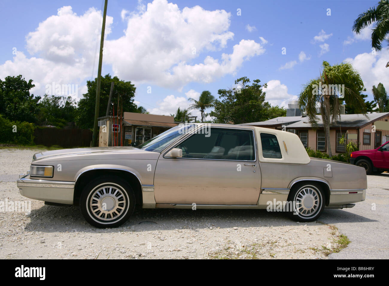aged classic car in beige color under blue sky Stock Photo - Alamy