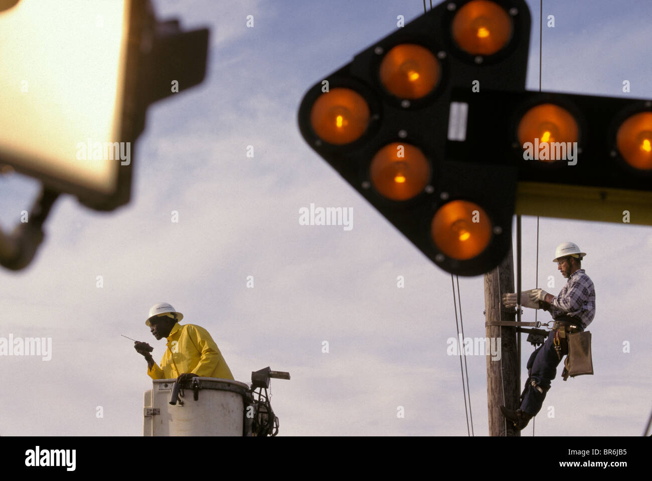 Electrical line workers Stock Photo - Alamy