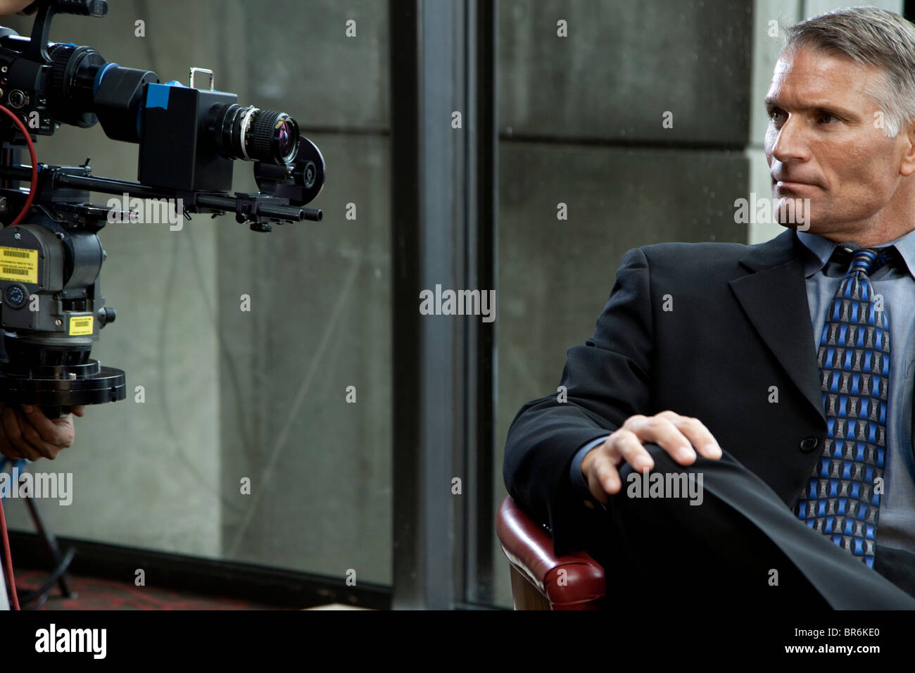 A businessman in front of a video camera Stock Photo - Alamy