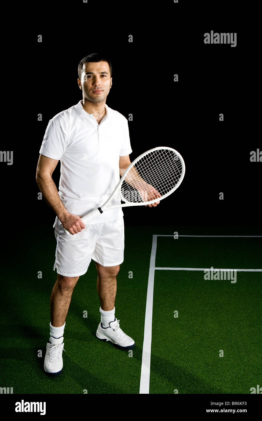 A tennis player, portrait, studio shot Stock Photo - Alamy