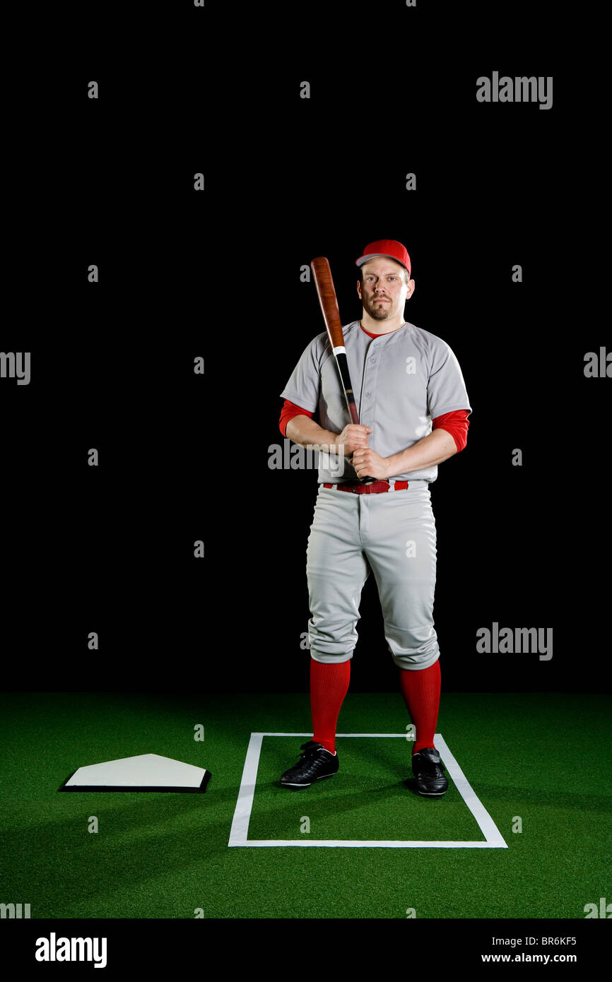 A baseball player, portrait, studio shot Stock Photo - Alamy