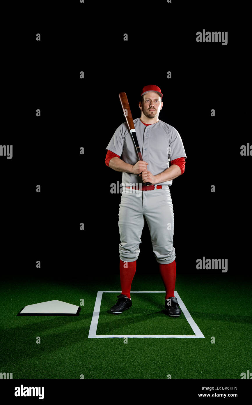 A baseball player, portrait, studio shot Stock Photo - Alamy