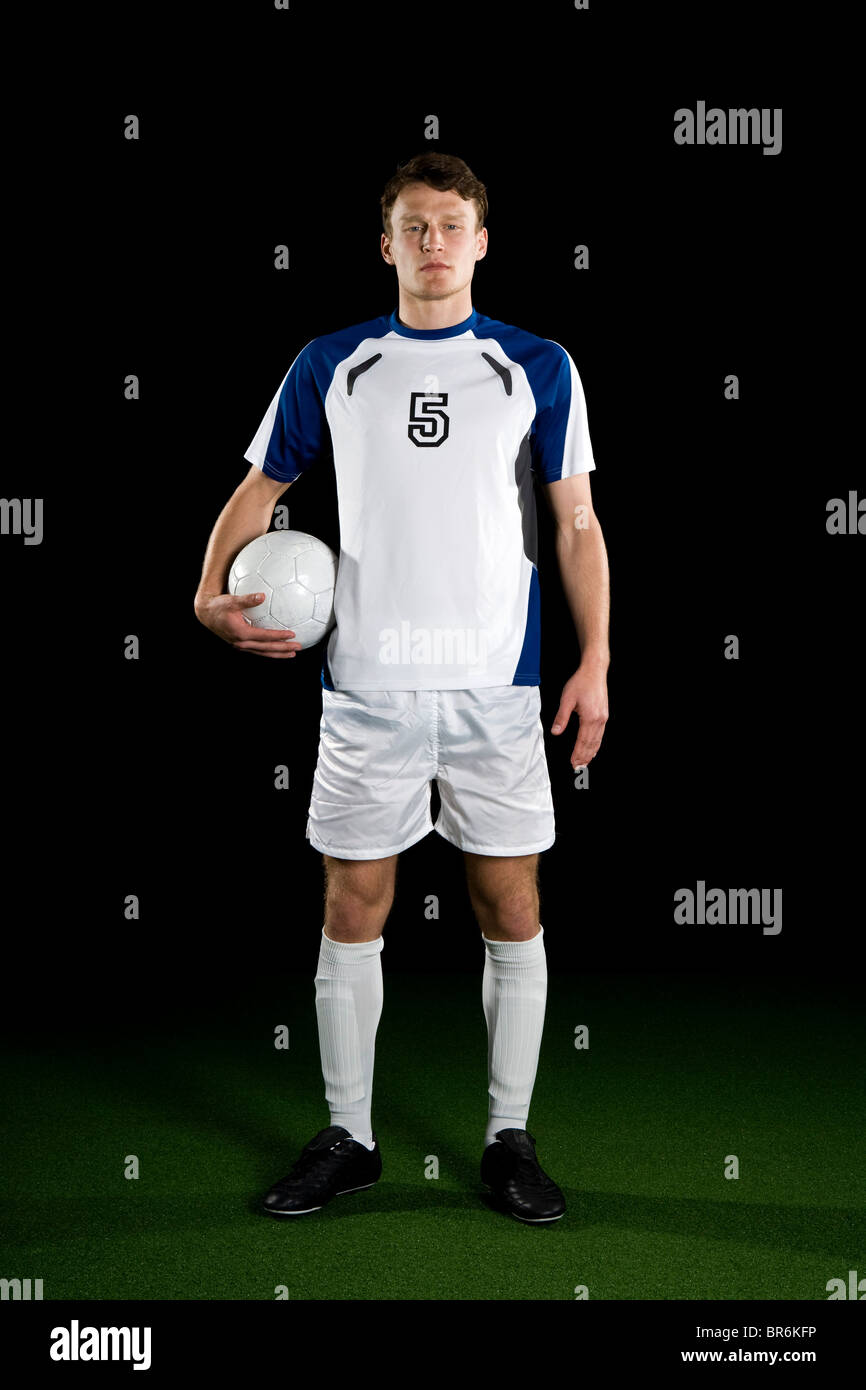 A soccer player, portrait, studio shot Stock Photo - Alamy