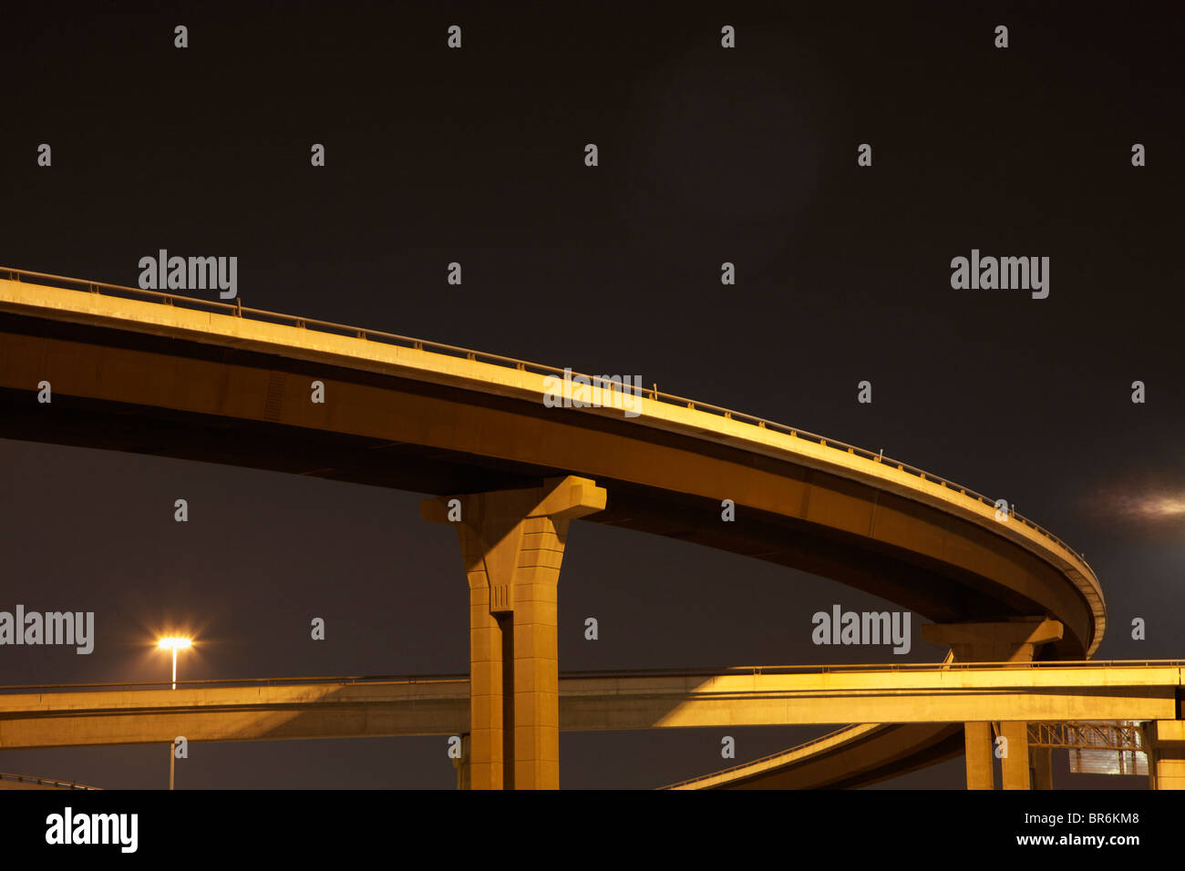 Low angle view of a highway overpass at night Stock Photo - Alamy