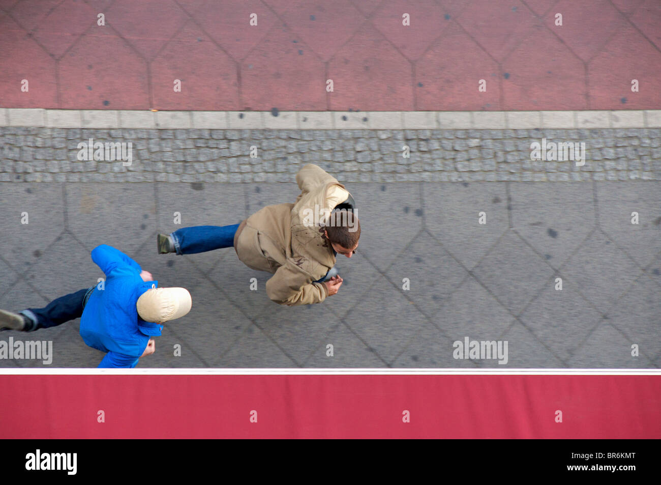 A man chasing his friend Stock Photo - Alamy