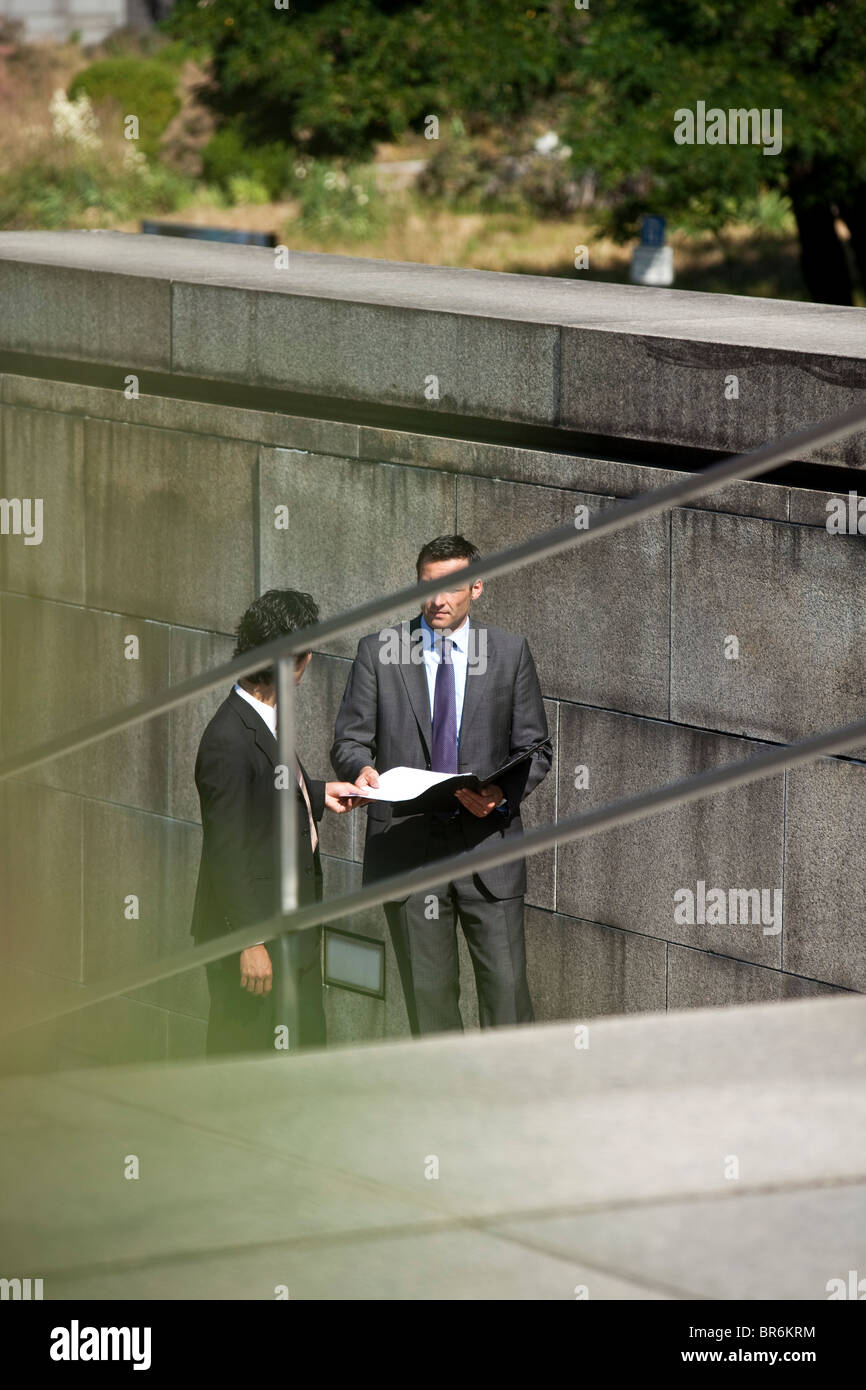 Two businessmen conducting suspicious business Stock Photo - Alamy
