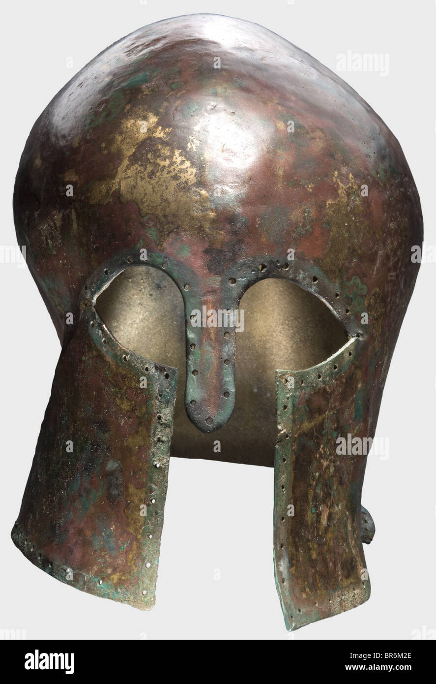 A Corinthian helmet, 6th century B.C. Bronze. Heavy, long stretched ...