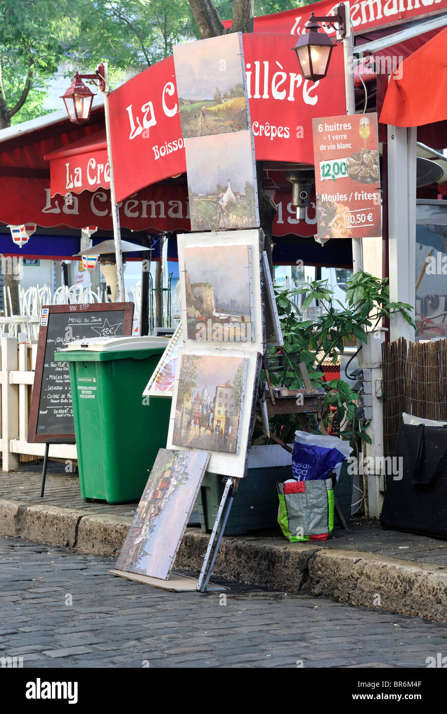 French Artist's painting on display in the market in the Montmartre ...